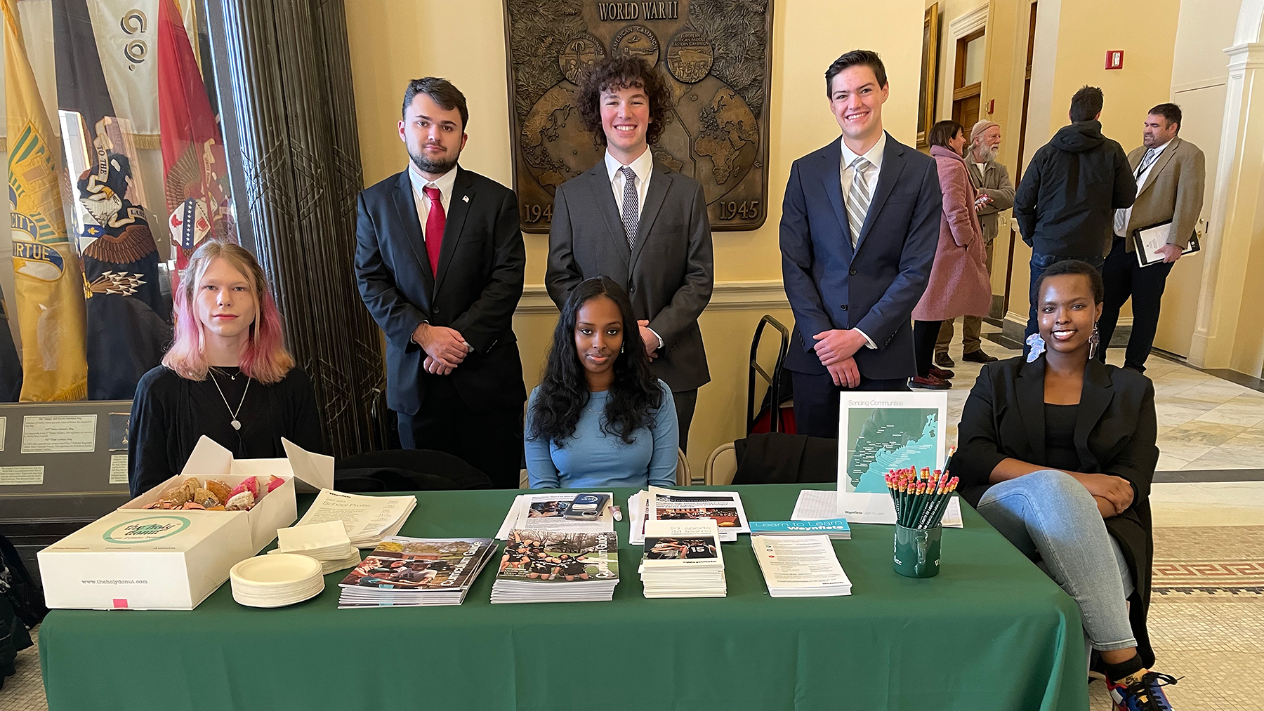 Upper School students speak with representatives at the State House ...