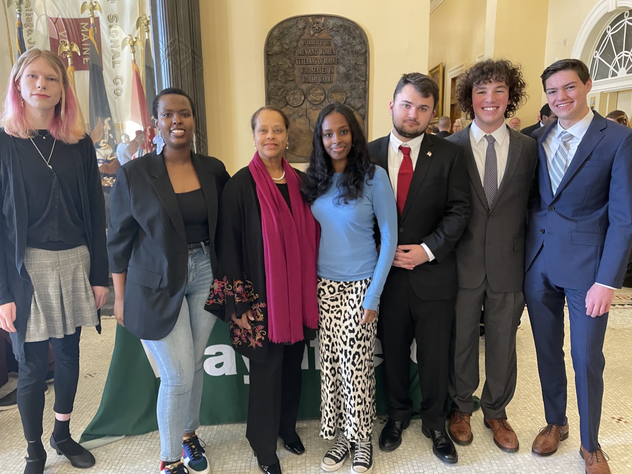 Upper School students speak with representatives at the State House ...